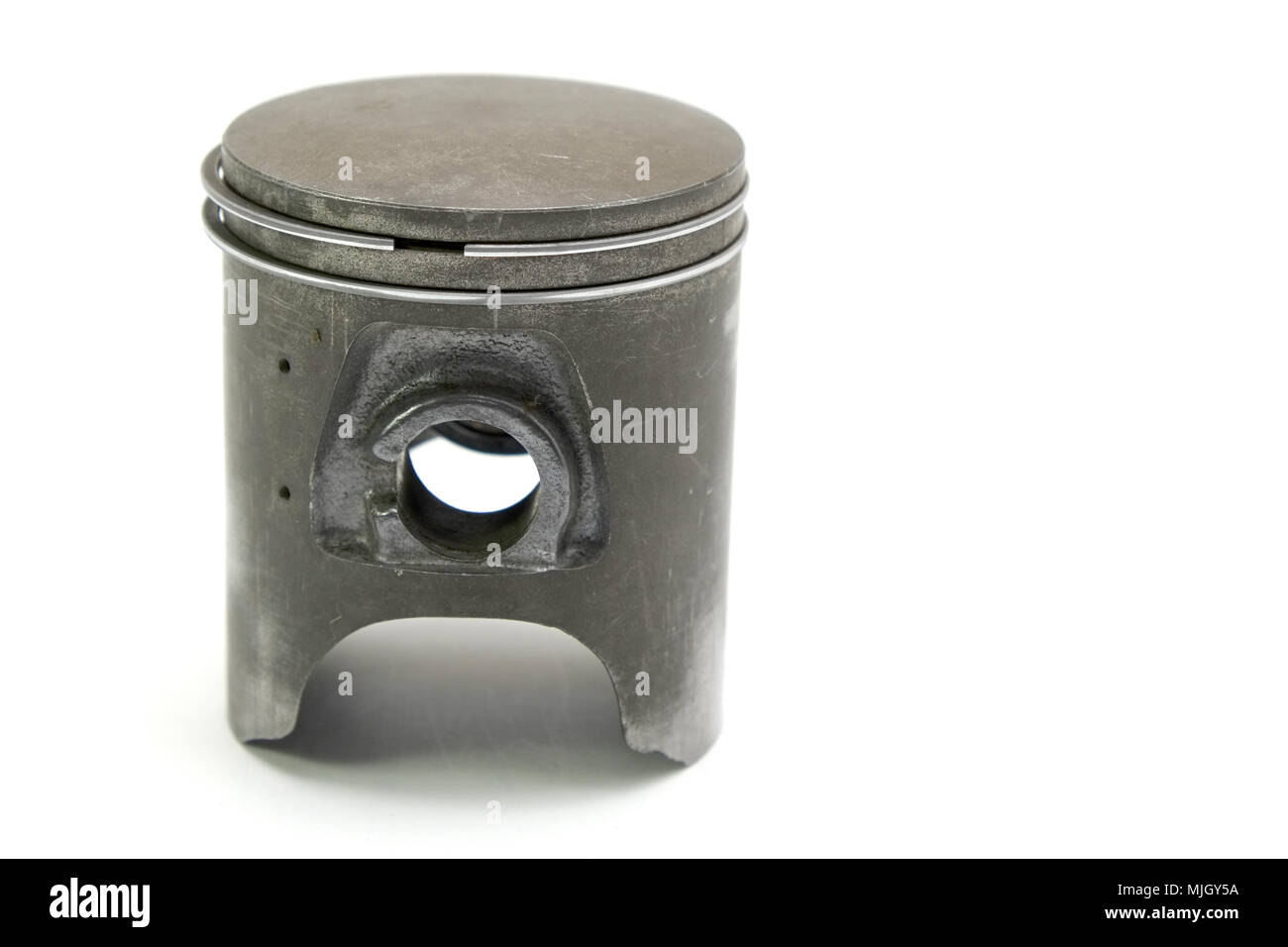 Old engine piston isolated on white background Stock Photo - Alamy