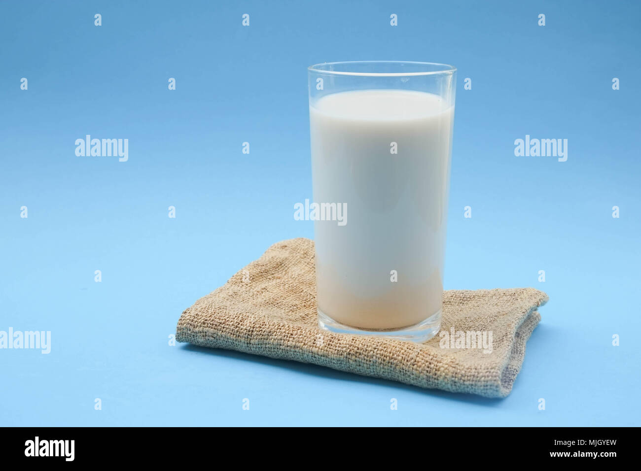 with milk on blue background Stock Photo - Alamy