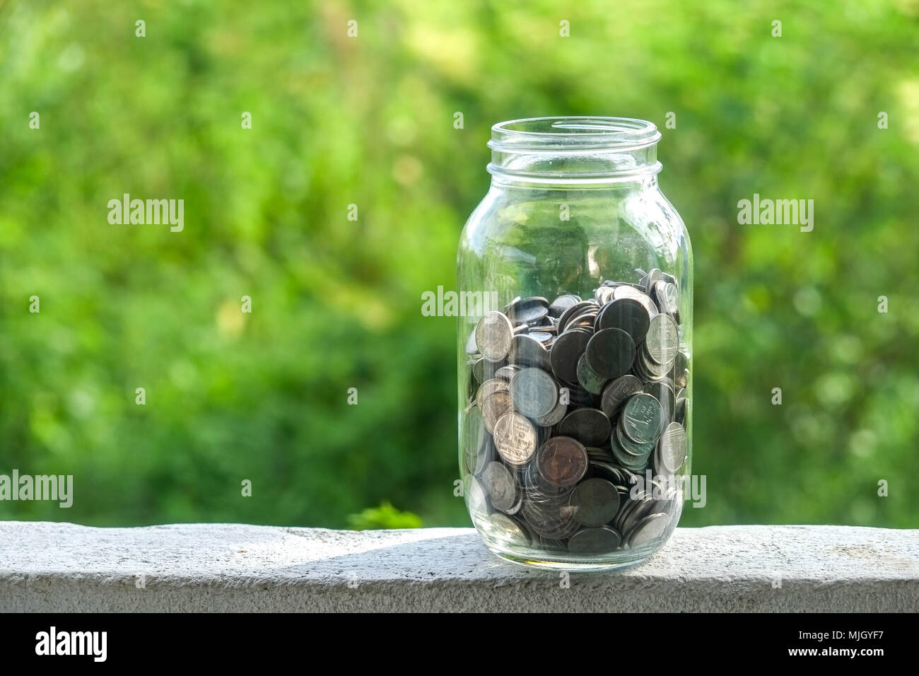 money in the glass Stock Photo - Alamy