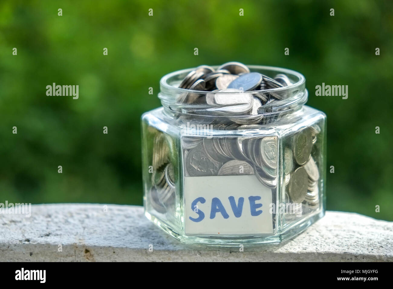 money in the glass Stock Photo - Alamy