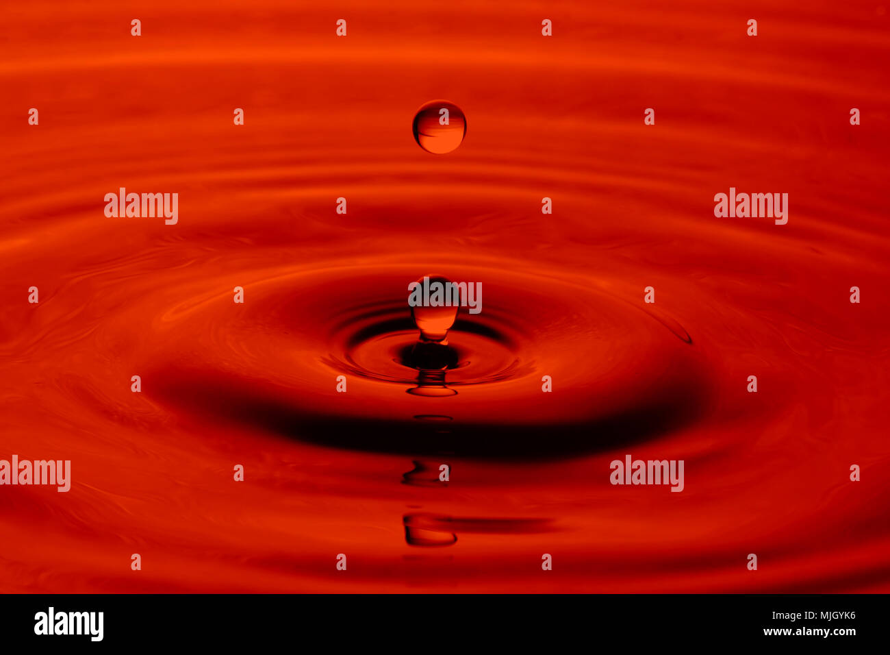 Drop of red water Stock Photo - Alamy