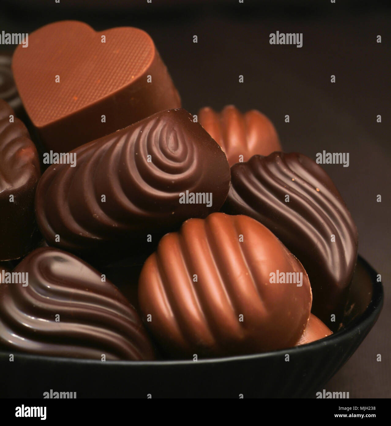 chocolate assorted with a background Stock Photo - Alamy