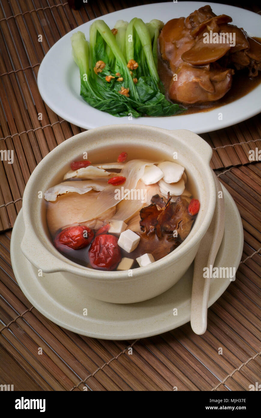 Chicken and herb soup in pot, Chinese food style Stock Photo - Alamy