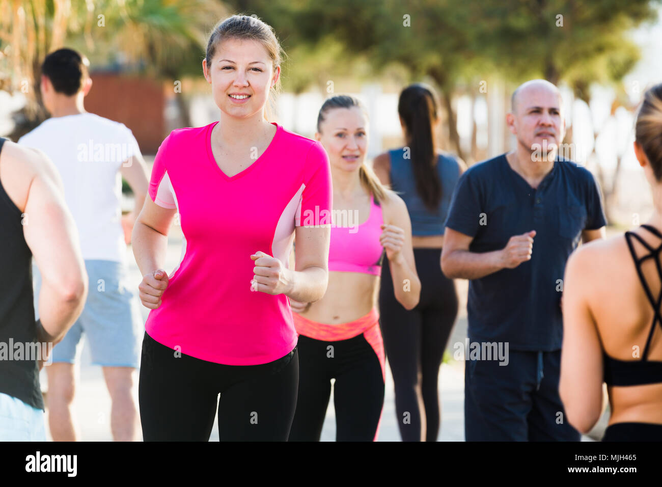 People leading healthy lifestyle, jogging during outdoor workout on ...