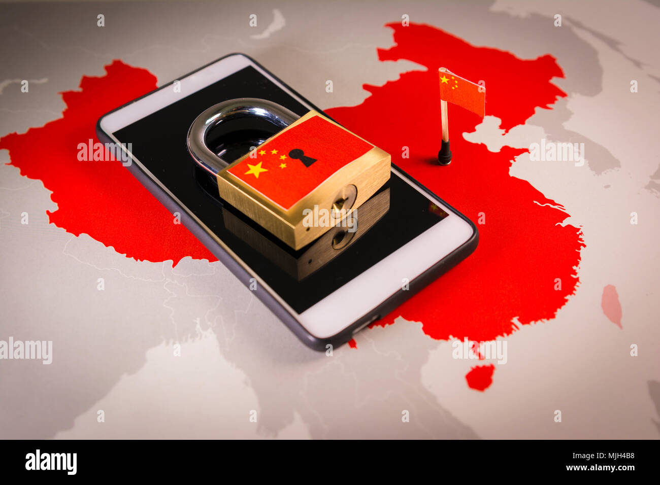 Padlock, China flag on a smartphone and China map, symbolizing the ...