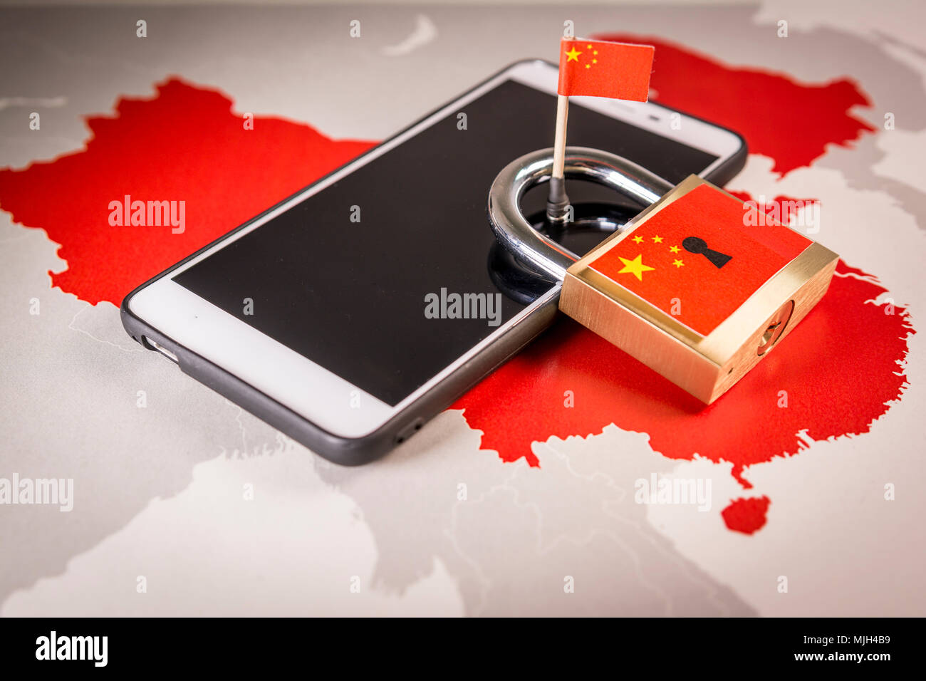 Padlock, China flag on a smartphone and China map, symbolizing the ...