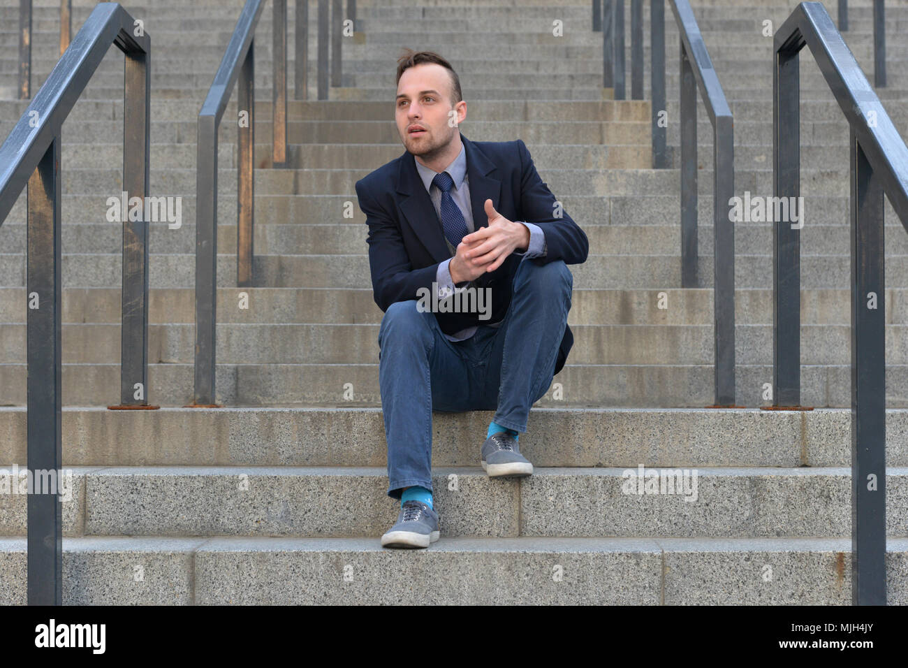 man sitting on the stairs Stock Photo - Alamy