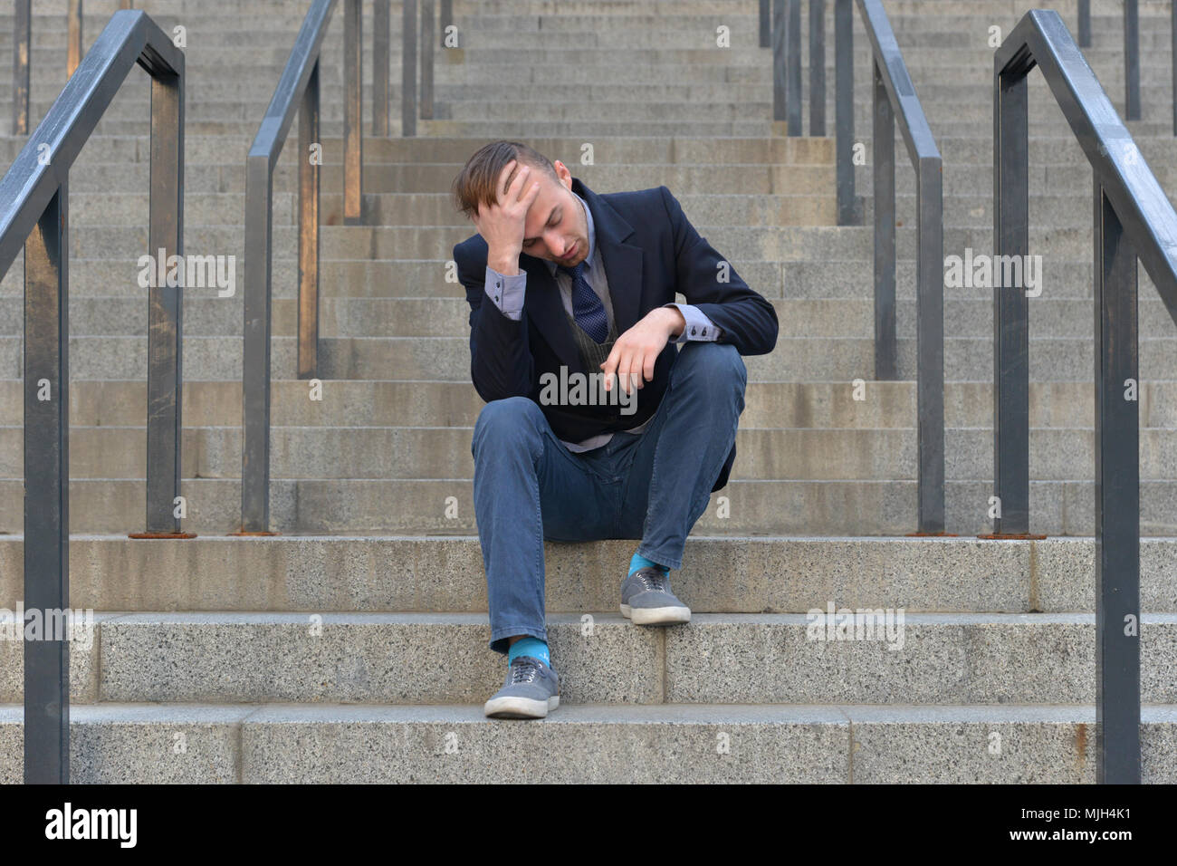 man sitting on the stairs Stock Photo - Alamy