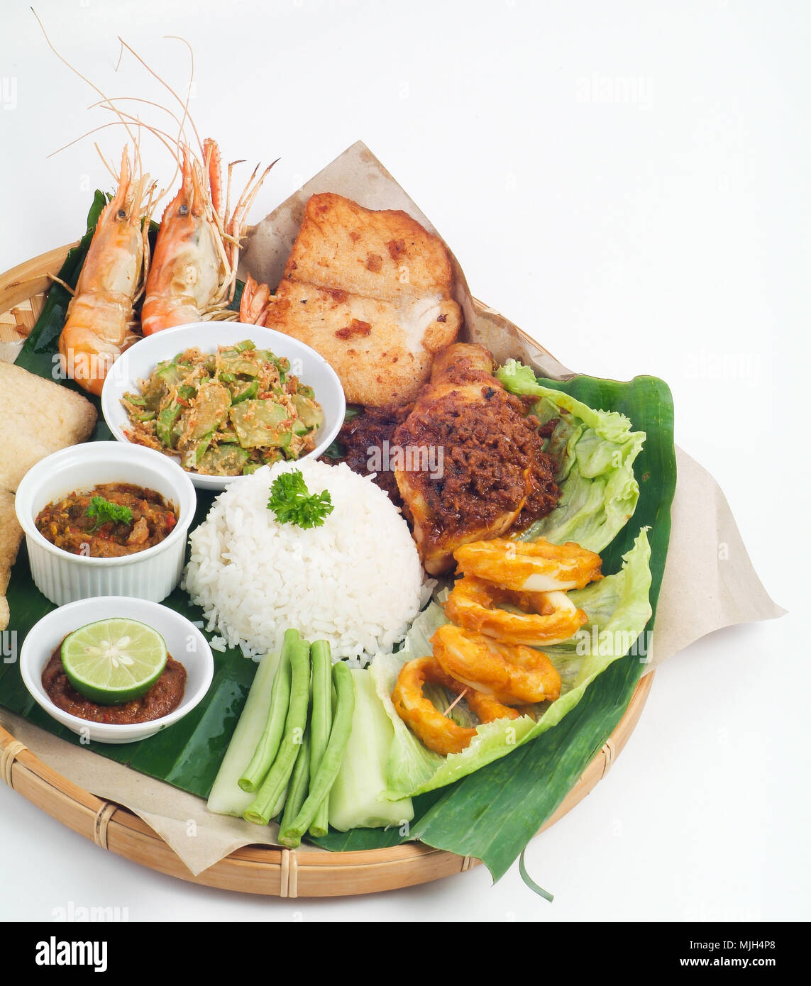 Indonesian traditional food, chicken, fish, vegetables Stock Photo - Alamy