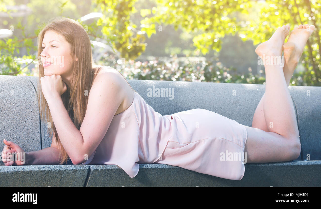 Girl poses on bench hi-res stock photography and images - Alamy