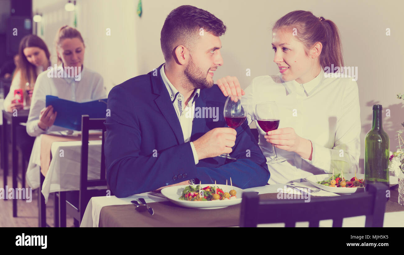 Gentleman with elegant woman are having dinner in luxury restaurante ...