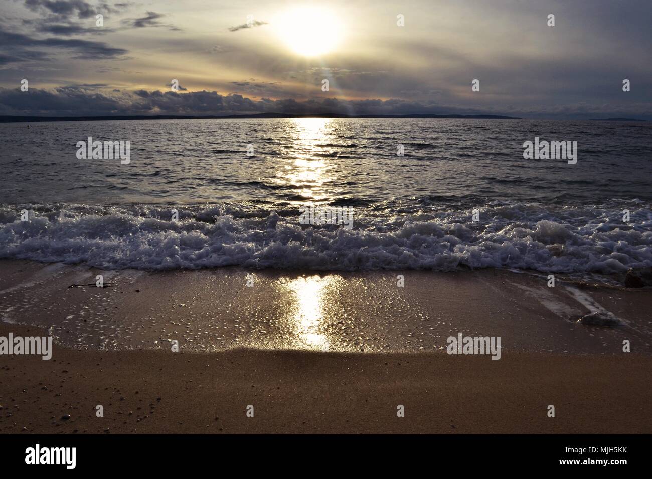 Landscape view of blue sea bay and wave on the beach during golden hour ...