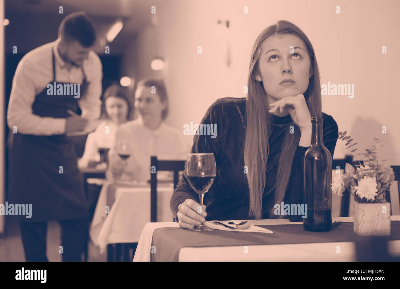 Woman eating alone in luxury restaurant hi-res stock photography and ...