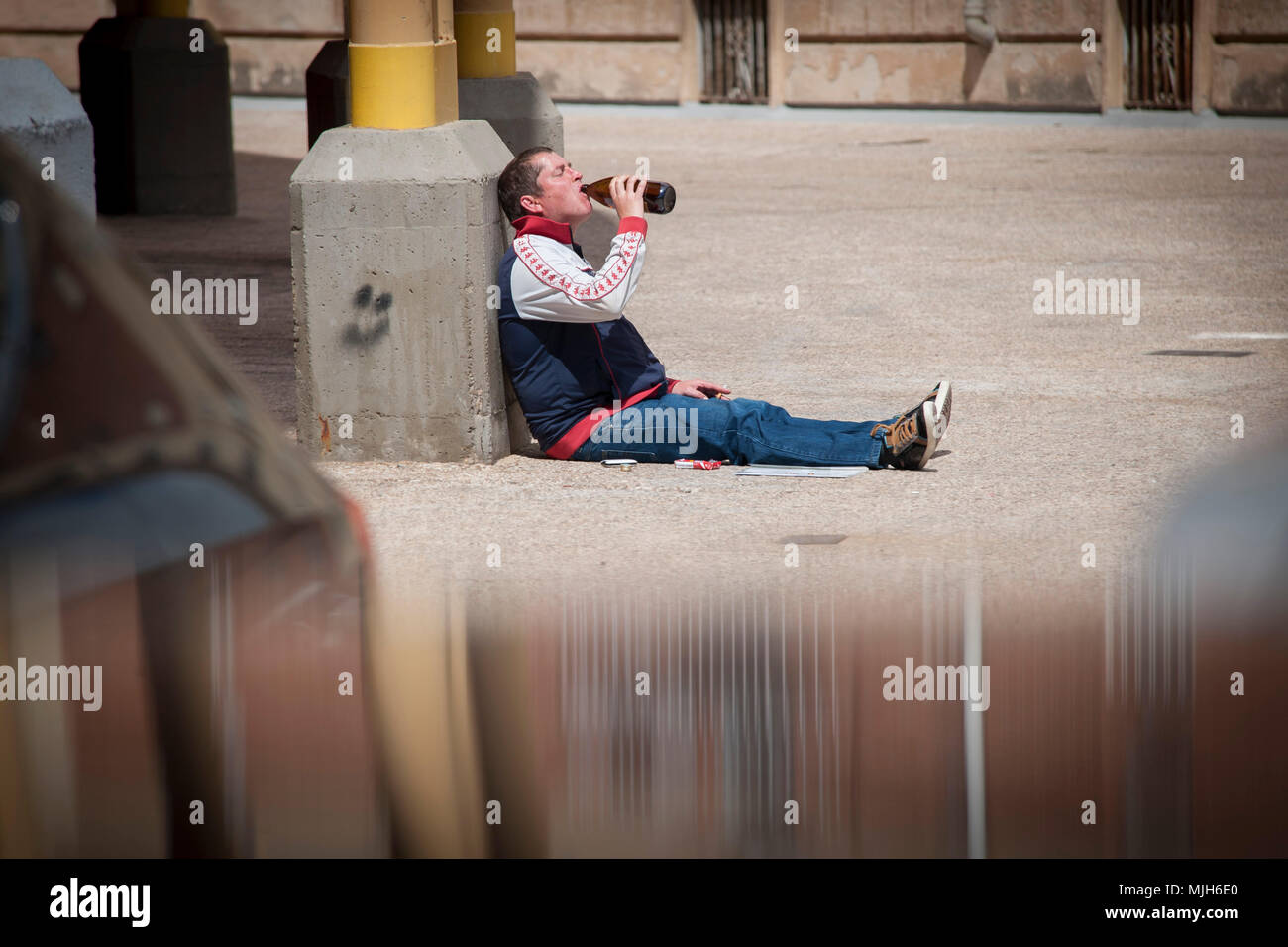 Alcoholic homeless man drinking hi-res stock photography and images - Alamy