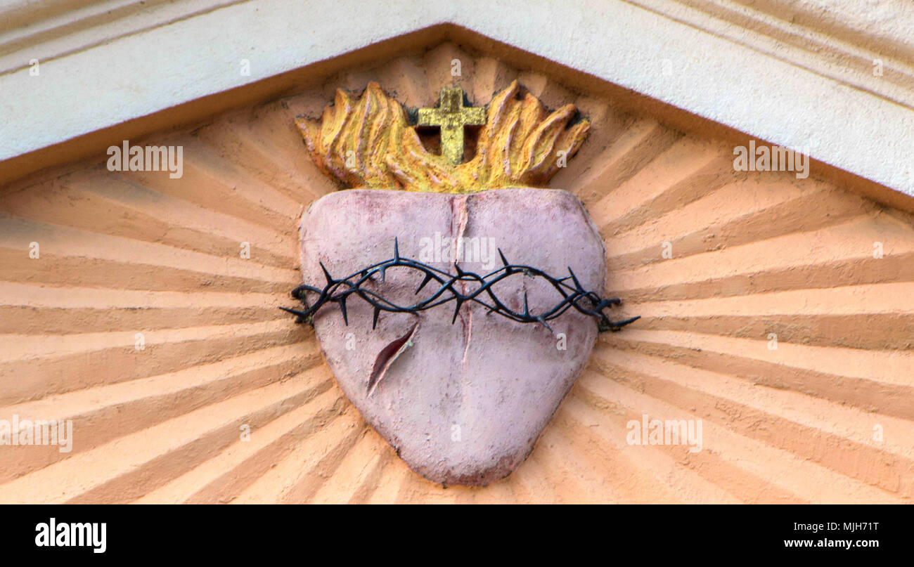 The coat of arms on the Catholic Church in the form of Jesus' heart ...