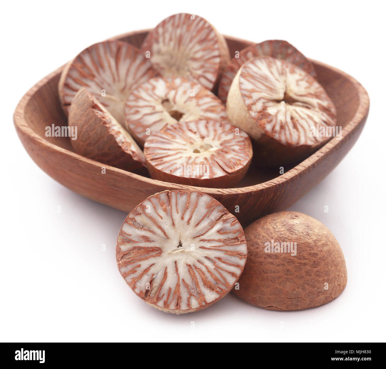 Betel nuts in a bowl over white background Stock Photo - Alamy