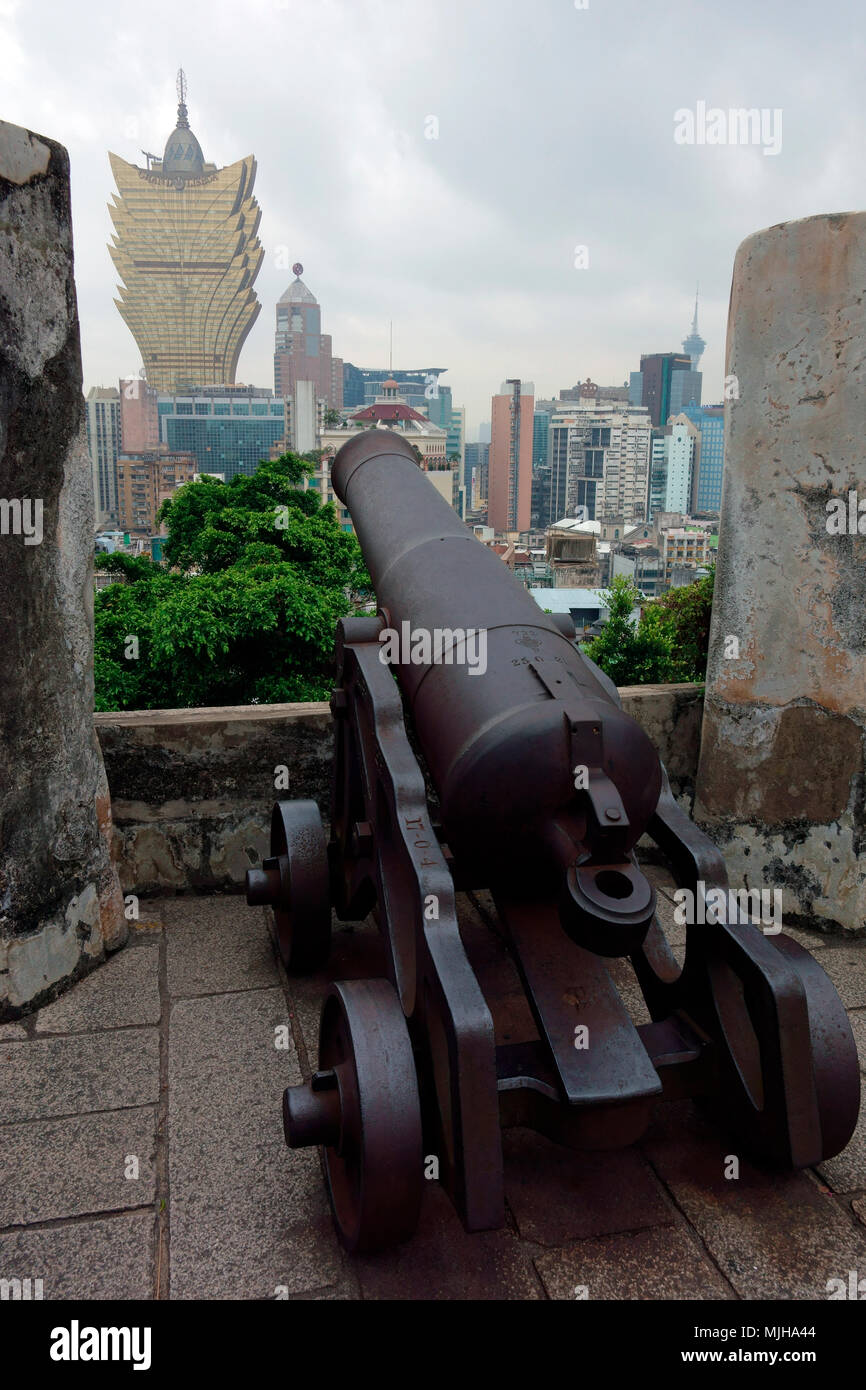 Cannon at the Monte Fort and Grand Lisboa Casino in the distance, Macau ...