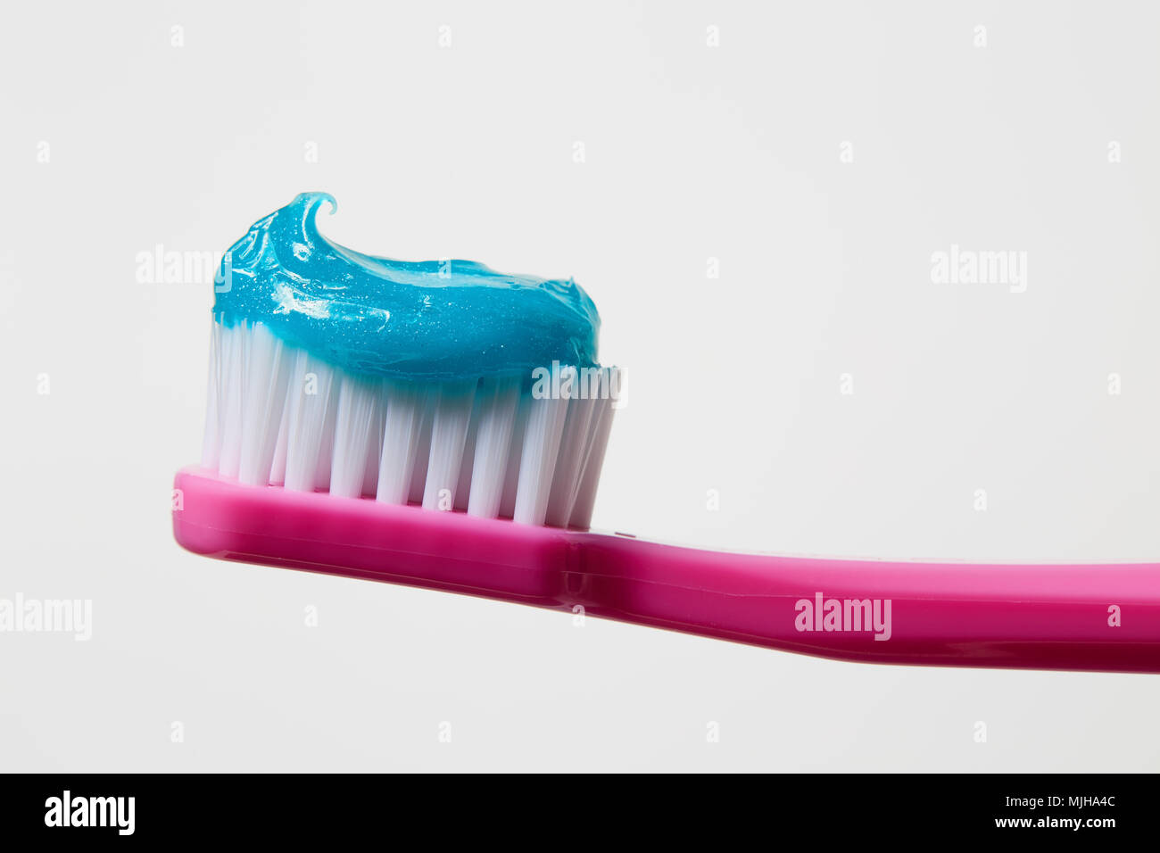 Toothbrush toothpaste blue background hi-res stock photography and ...