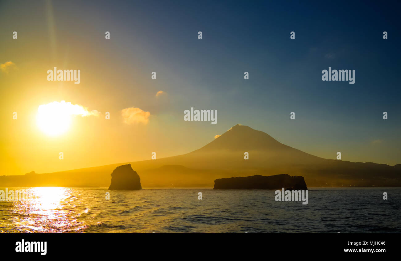Sunrise over Pico volcano and island at Azores, Portugal Stock Photo ...