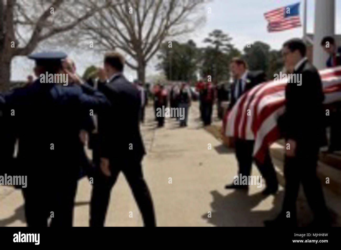 The remains of Col. Edgar “Felton” Davis are escorted to the hearse ...
