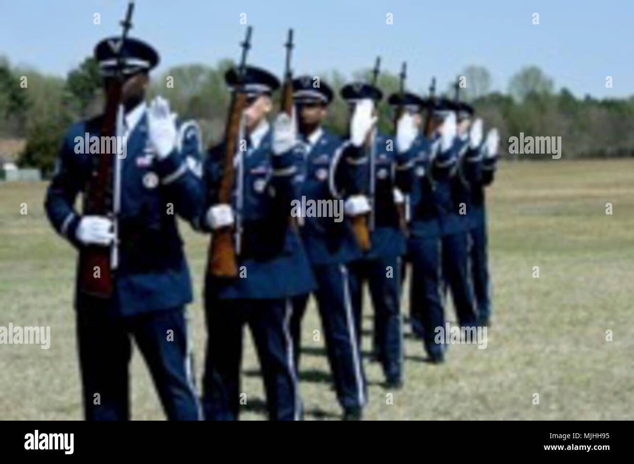 The 4th Fighter Wing base honor guard performs a 21-gun salute during ...
