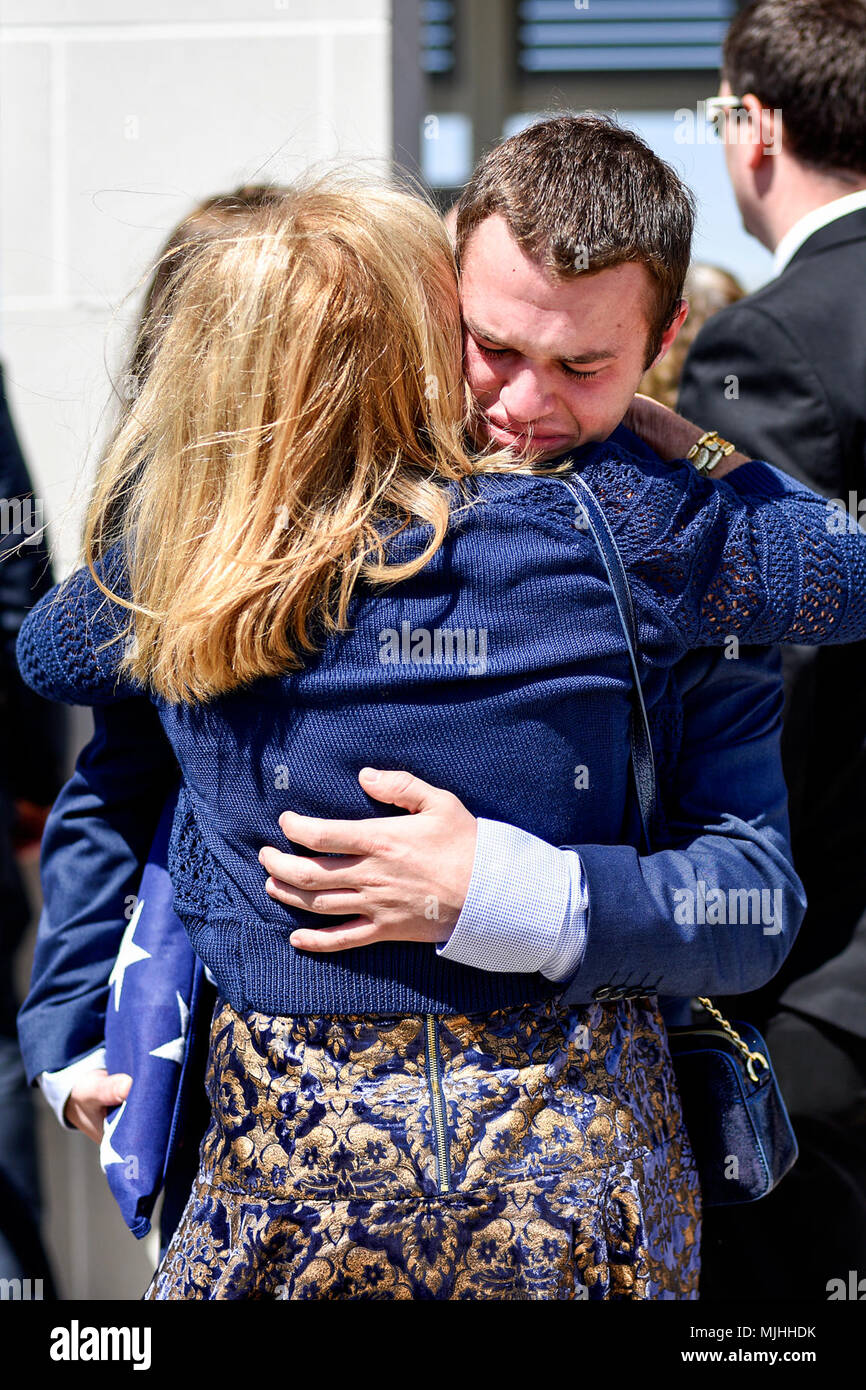 Matt Davis, grandson of Col. Edgar "Felton" Davis, hugs a family member ...