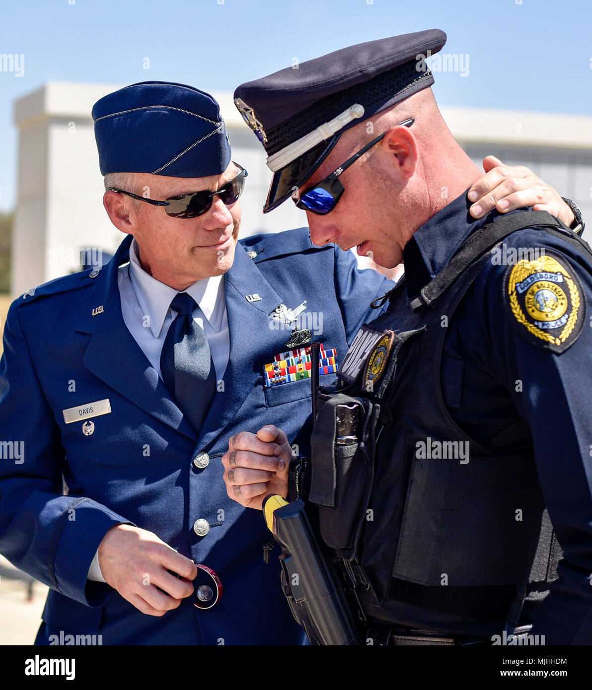 Retired Col. Allen Davis, son of Col. Edgar "Felton" Davis, hugs ...