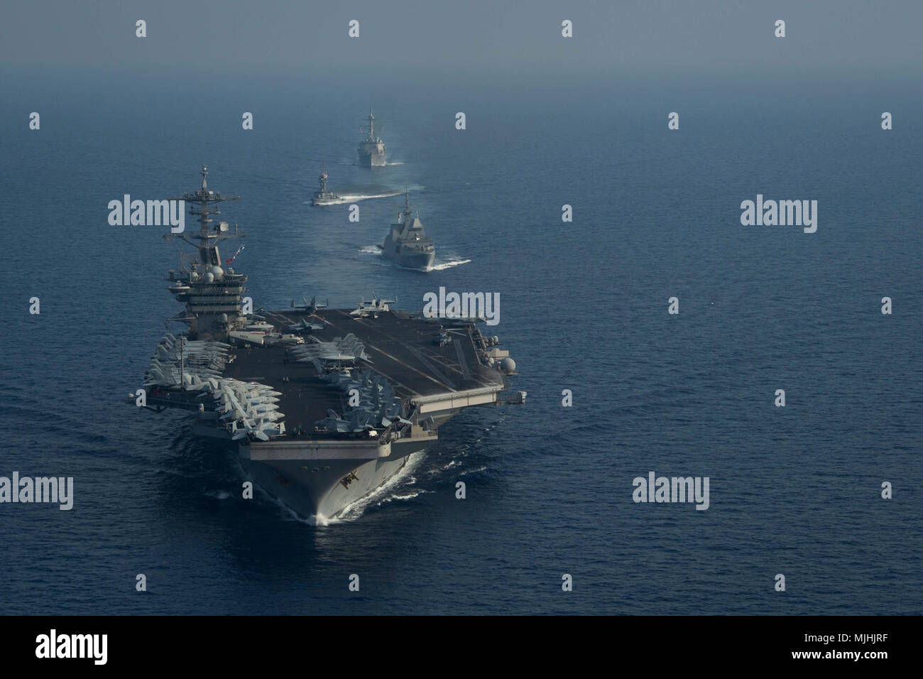 SOUTH CHINA SEA (April 6, 2018) The aircraft carrier USS Theodore Roosevelt (CVN 71) leads a ...