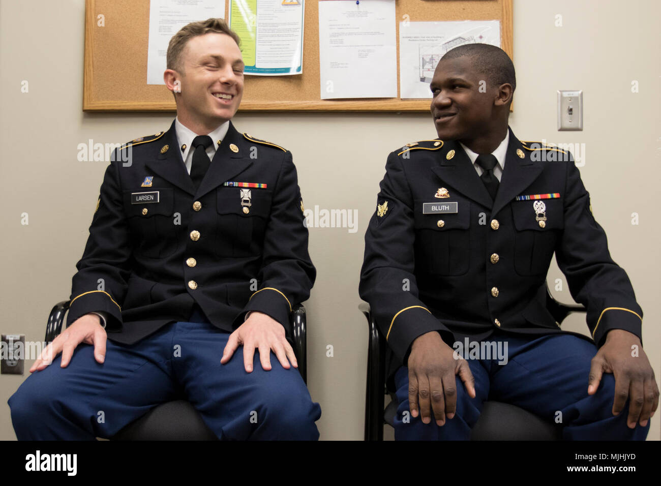 Spc. Mitchell Larsen from the 300th Military Intelligence Battalion and Spc Bryton Bluth from ...