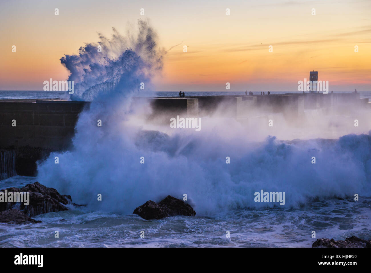 Spectacular wave crash on rocks seen from breakwater in Foz do Douro ...