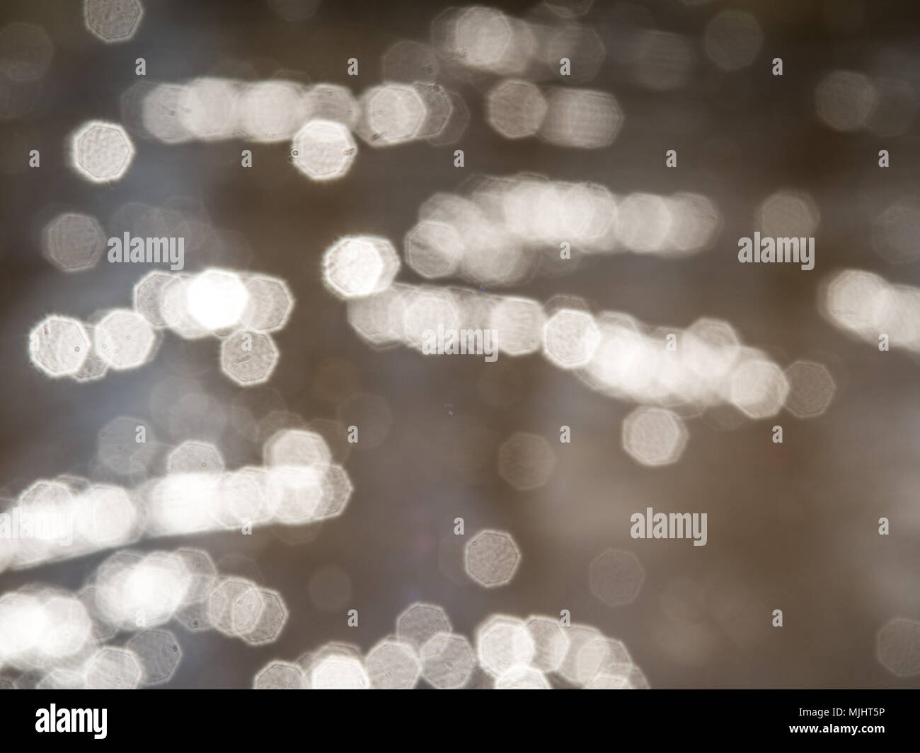 Background. Texture. Blurry light spots, bokeh. Light reflection on the ...