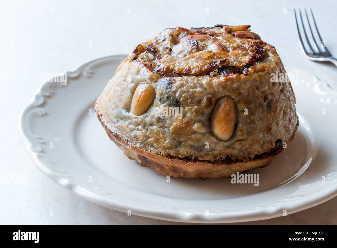 Turkish Perde Pilavi / Drape pilaf with chicken, almond and raisin ...