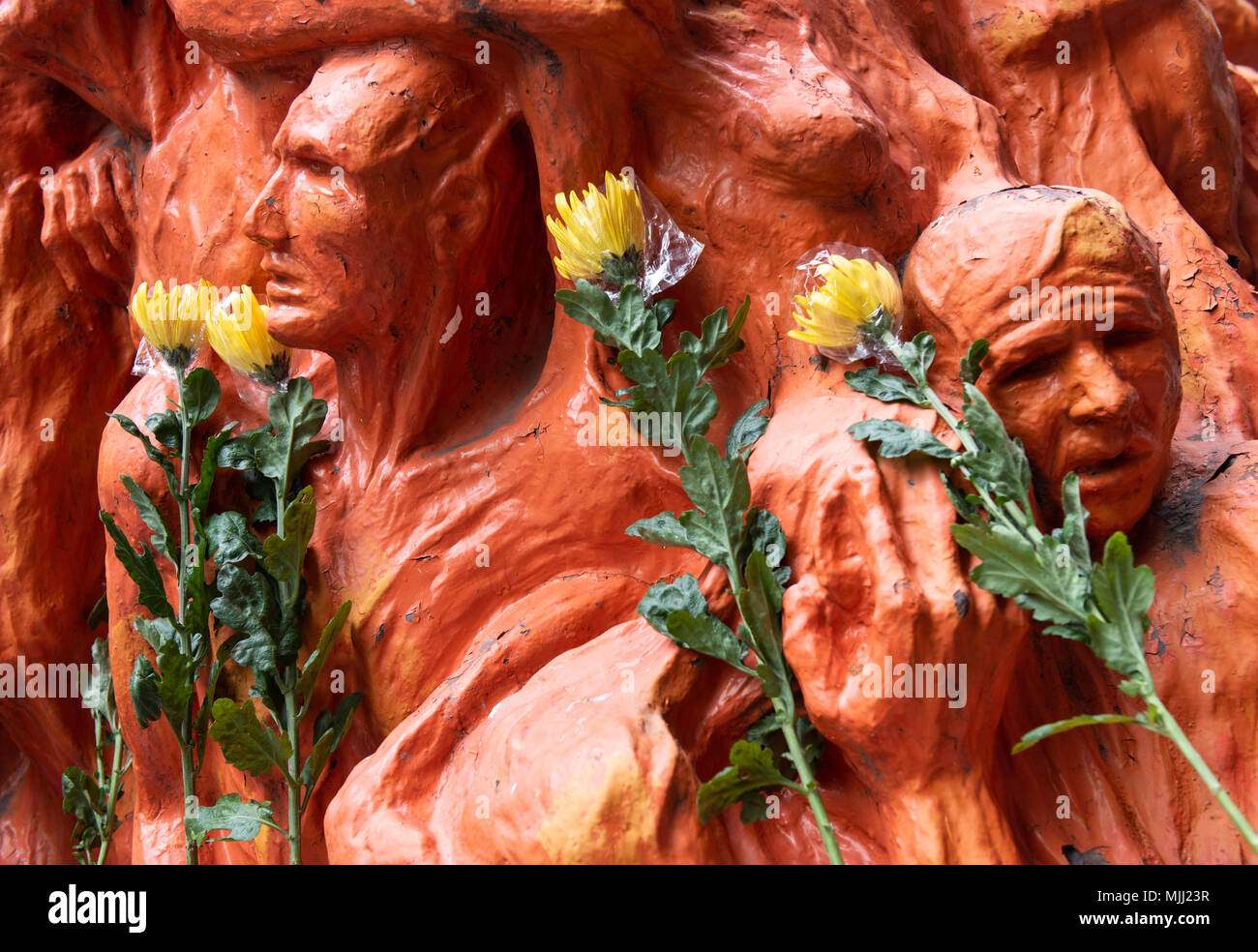 Annual cleaning of Danish artist Jens Galschiot's "Pillar of Shame" at ...