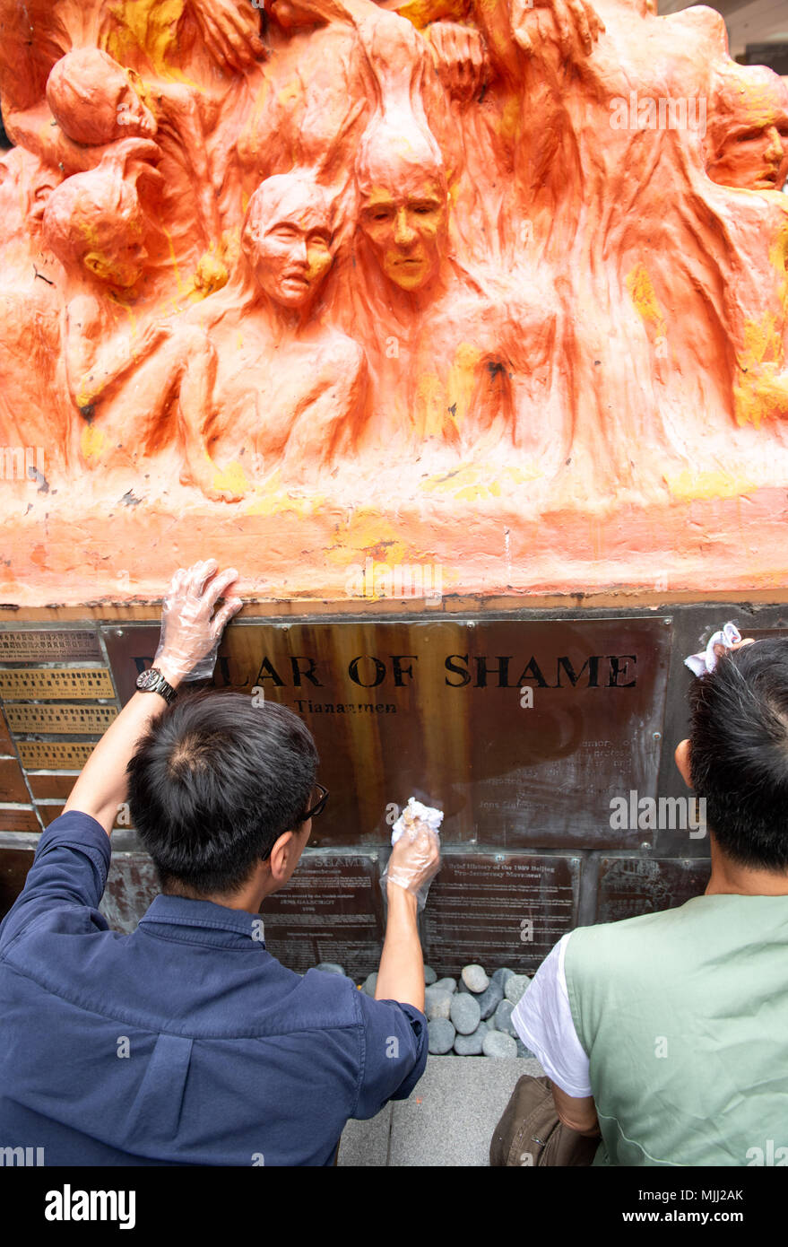 Annual cleaning of Danish artist Jens Galschiot's "Pillar of Shame" at ...