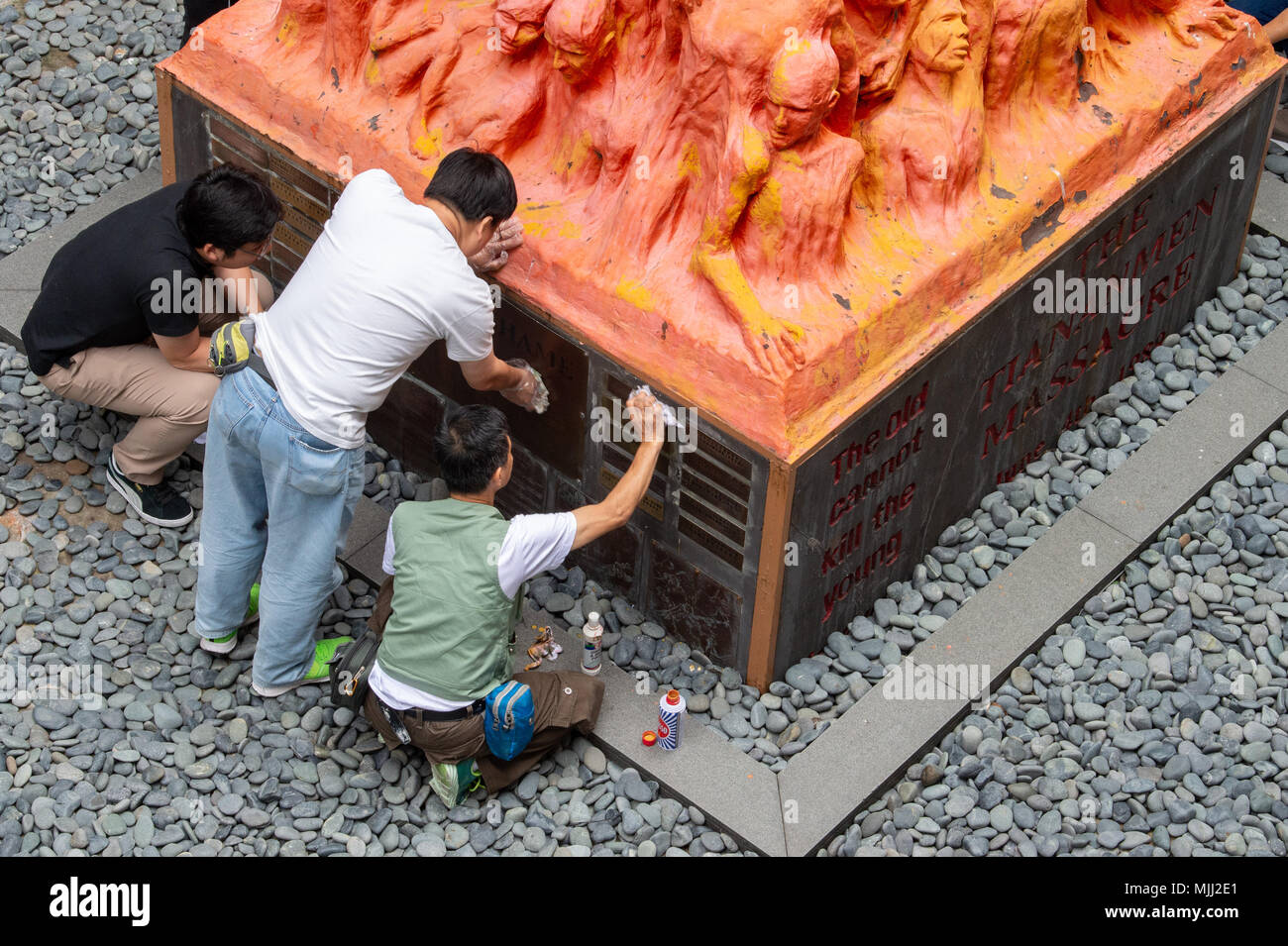 Annual cleaning of Danish artist Jens Galschiot's "Pillar of Shame" at ...