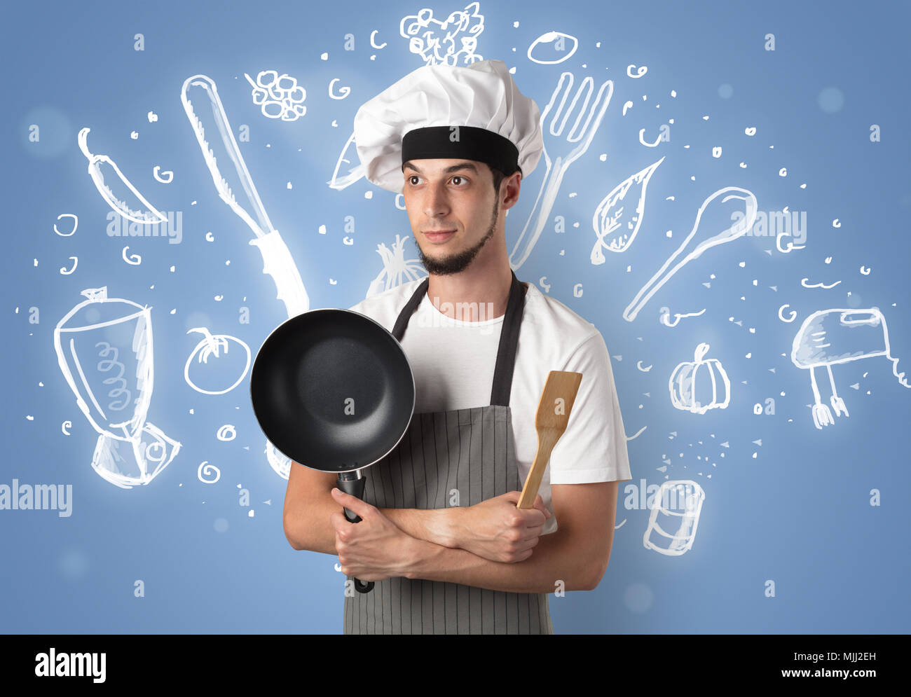 Young cook with kitchen instruments and drawn recipe concept on ...