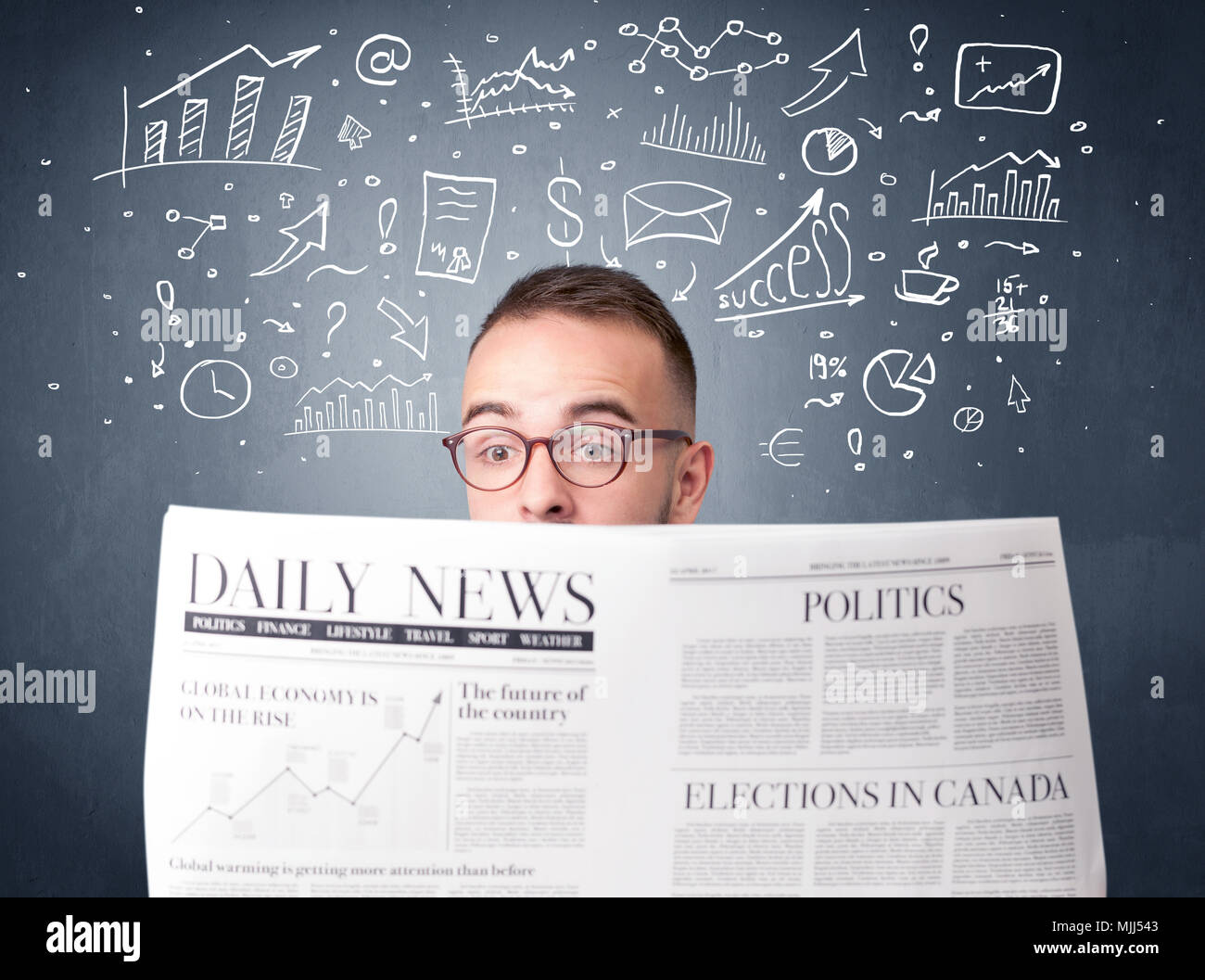 Young smart businessman reading daily newspaper with business plan ...