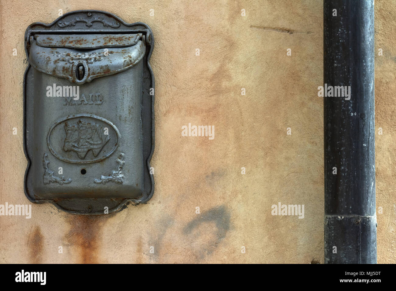 Old antique metal mailbox on the wall with yellow plaster, old Jaffa ...
