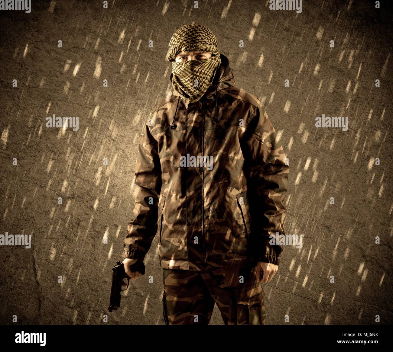 Portrait of dangerous heavily armed terrorist soldier with mask on ...
