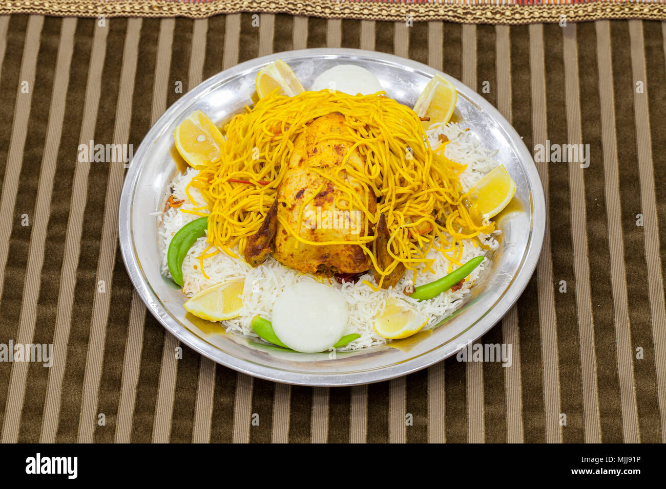 Arabic Roasted chicken with spaghetti Stock Photo - Alamy