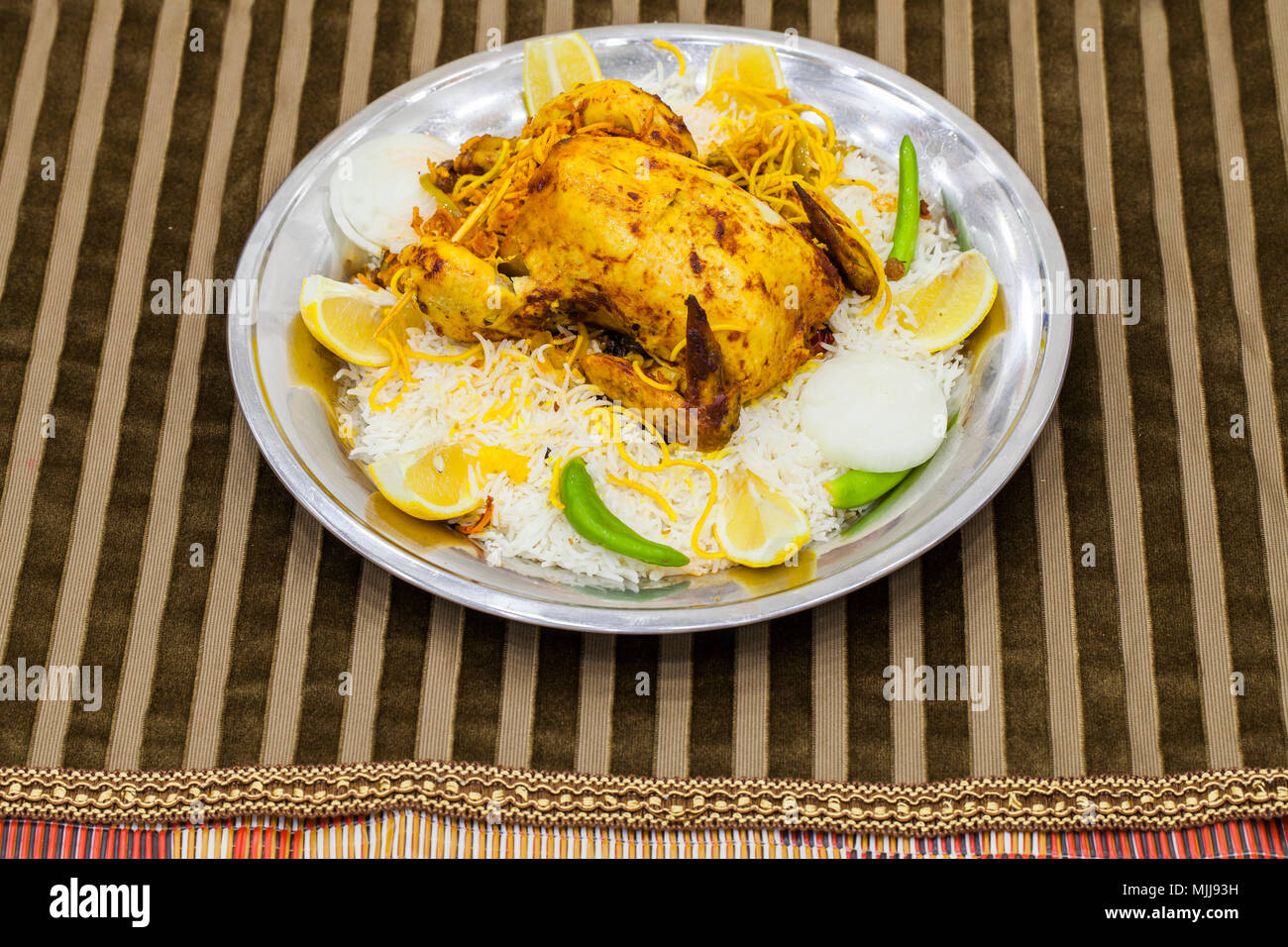 Arabic Roasted chicken with rice "Mandi Stock Photo - Alamy