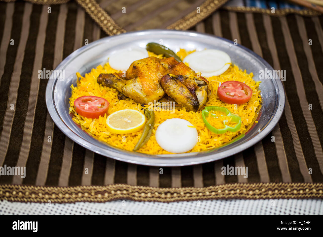 Arabic Roasted chicken with rice "Mandi Stock Photo - Alamy