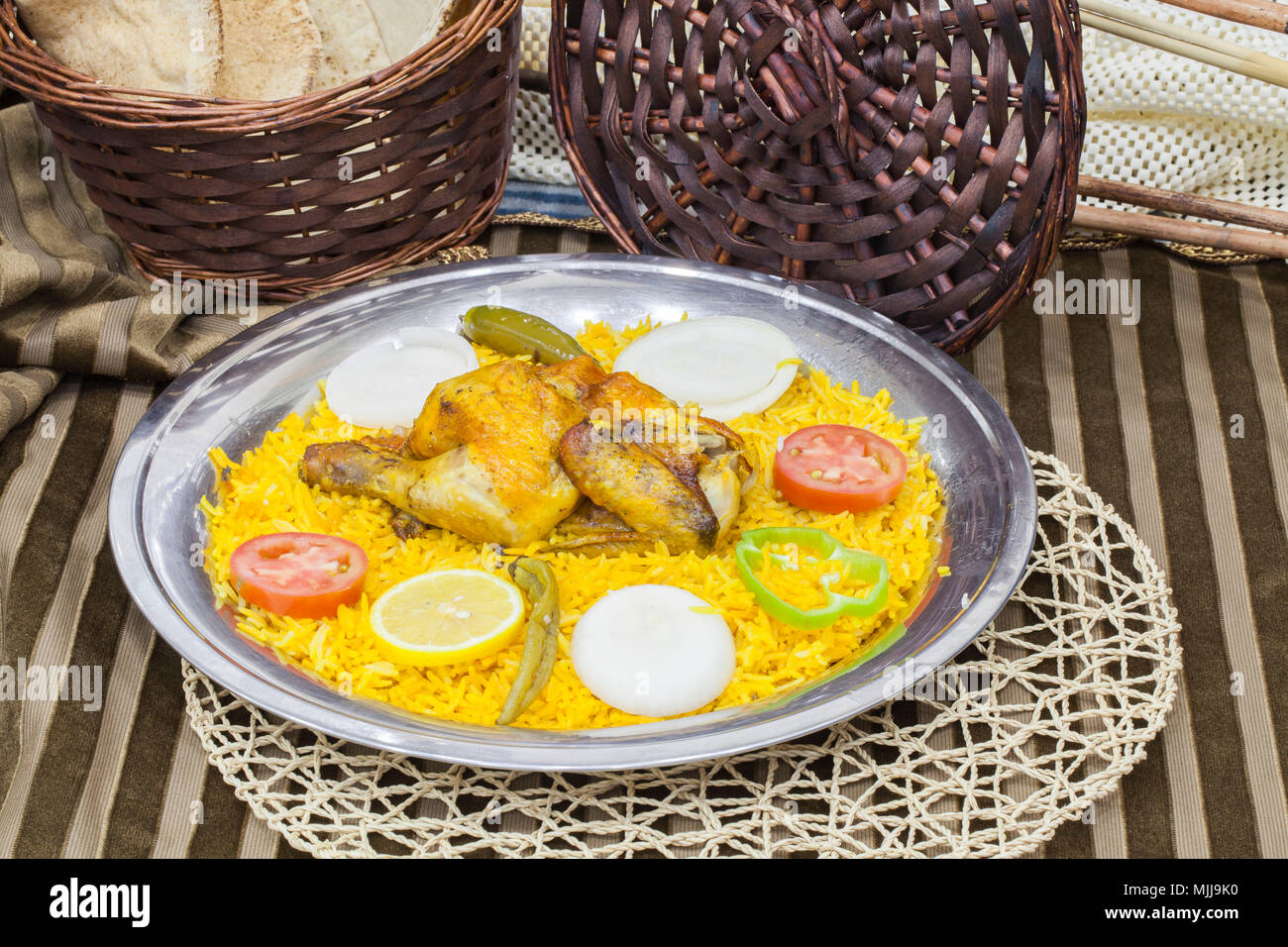 Arabic Roasted chicken with rice "Mandi Stock Photo - Alamy