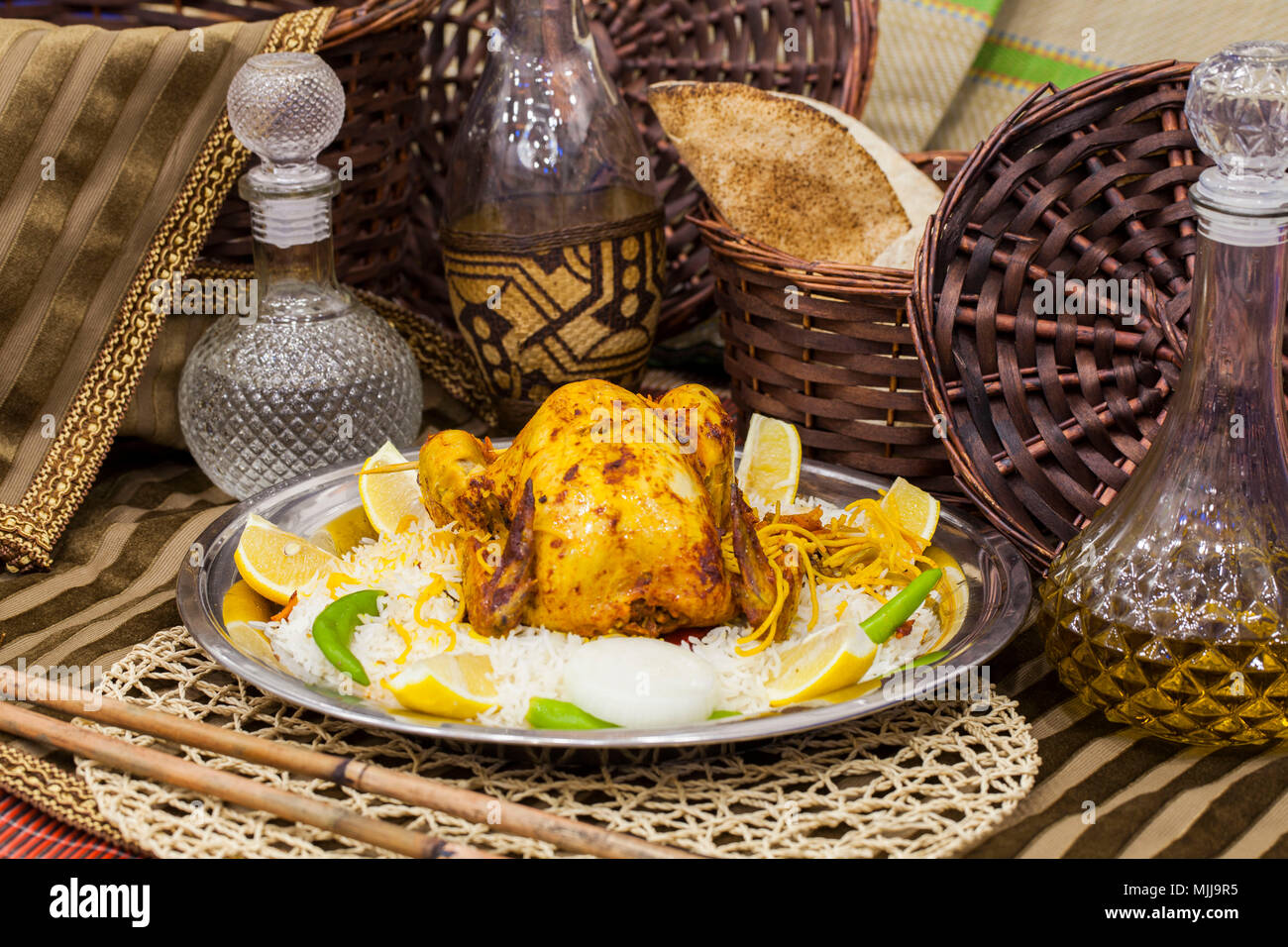 Arabic Roasted chicken with rice "Mandi Stock Photo - Alamy