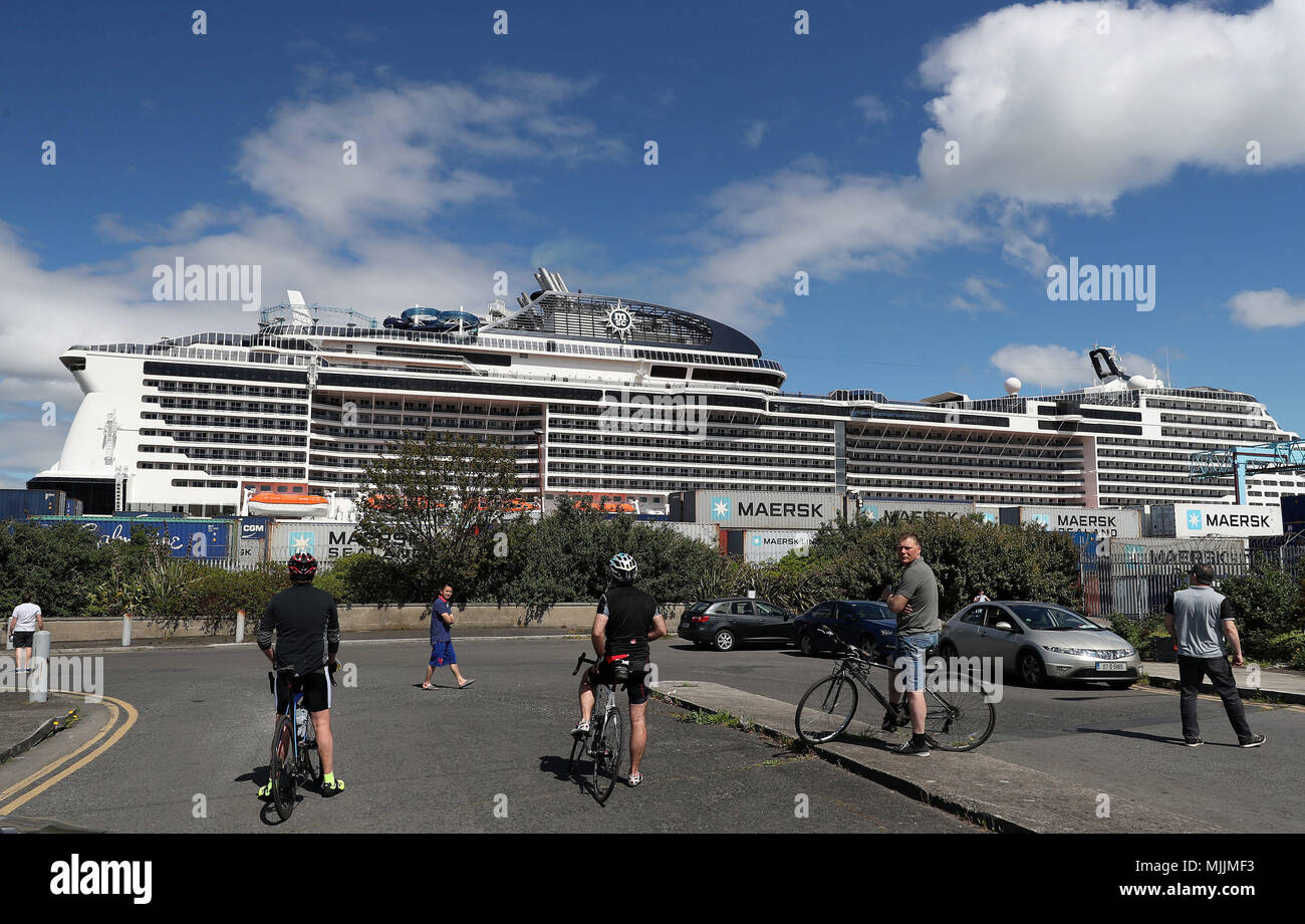 People stop to look at the MSC Meraviglia as it's docked in Dublin ...