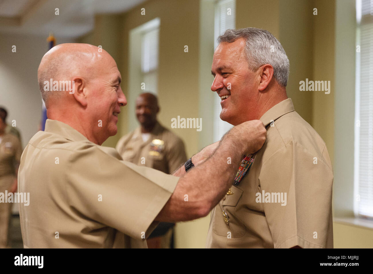 U.S. Southern Command Commander, U.S. Navy Adm. Kurt W. Tidd, adjusts U ...