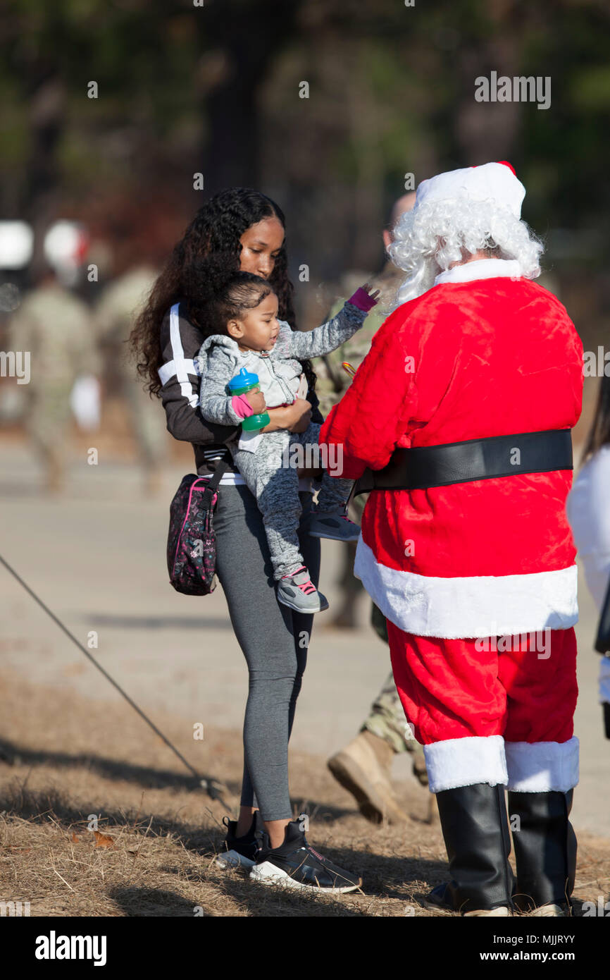 Children anxiously await the arrival of Santa Claus as he walks off the ...