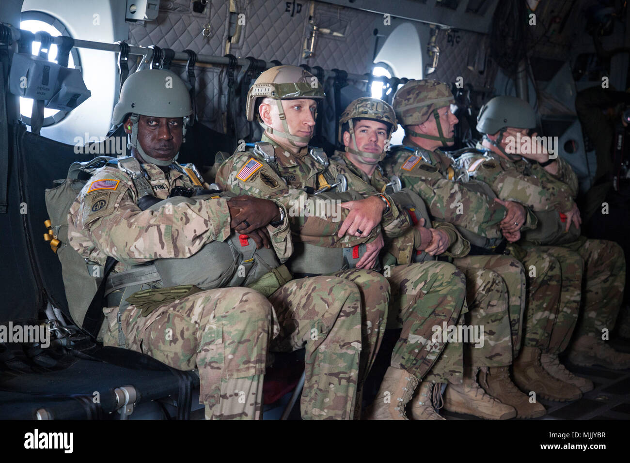 U.S. Army paratroopers wait for commands from Jumpmasters prior to ...