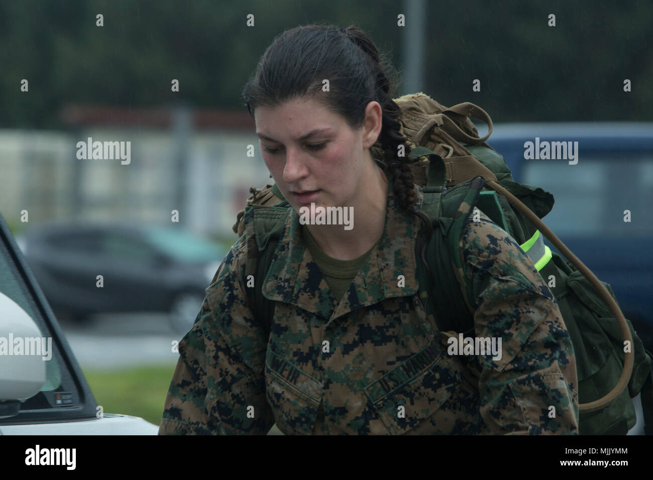 Cpl. Alexandra Weir finishes an eight mile run with a 55 pound pack ...