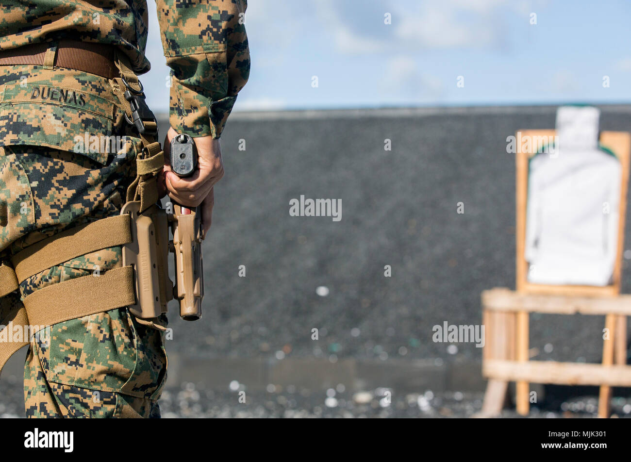 U.S. Marine Corps Lance Cpl. Traython J. Duenas, an ammo technician ...